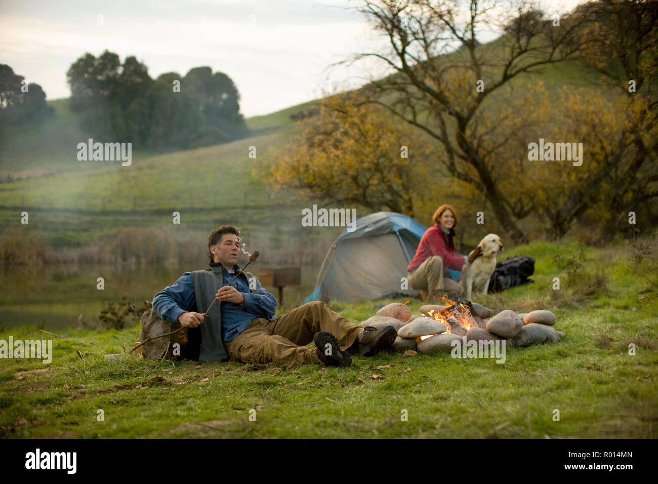 Sitting beside fire hi-res stock photography and images - Alamy