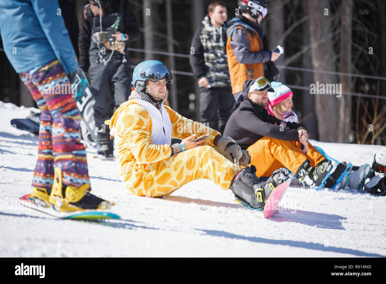 BUKOVEL,UKRAINE-20 MARCH,2018: Snowboard contest in winter park.Young ...