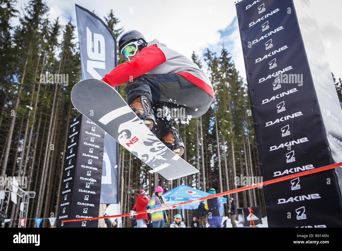 BUKOVEL,UKRAINE-20 MARCH,2018: Snowboard contest in winter park.Young ...