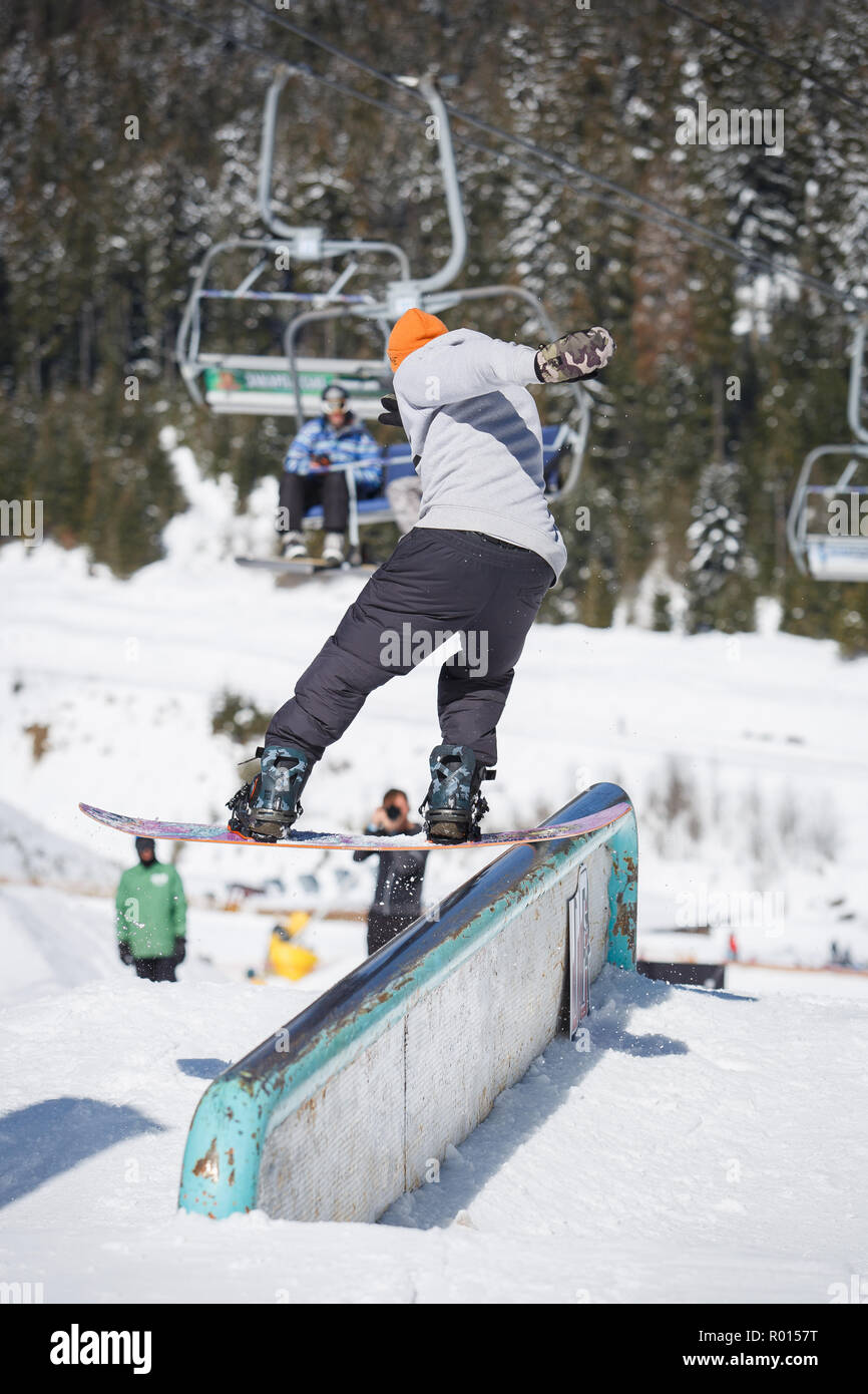 BUKOVEL,UKRAINE-24 MARCH,2018: Snowboard jib contest on rails in snow ...