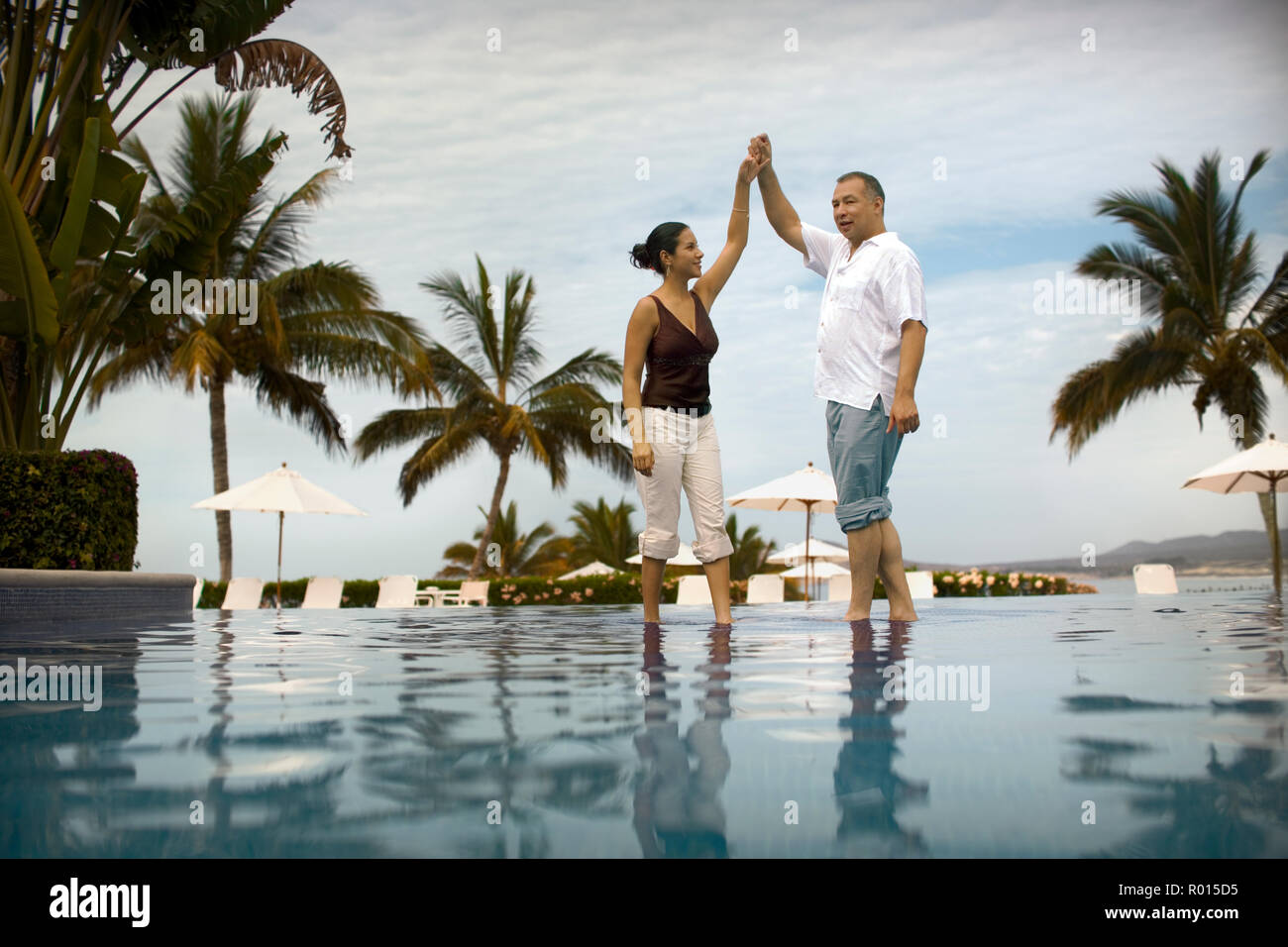 Man standing near swimming pool hi-res stock photography and images - Alamy