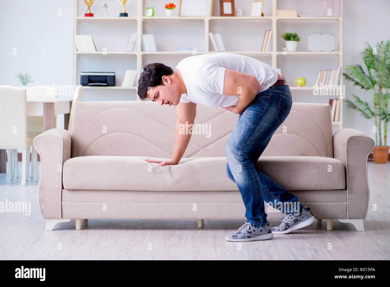 Sick man suffering at home from infection and bad stomach Stock Photo ...