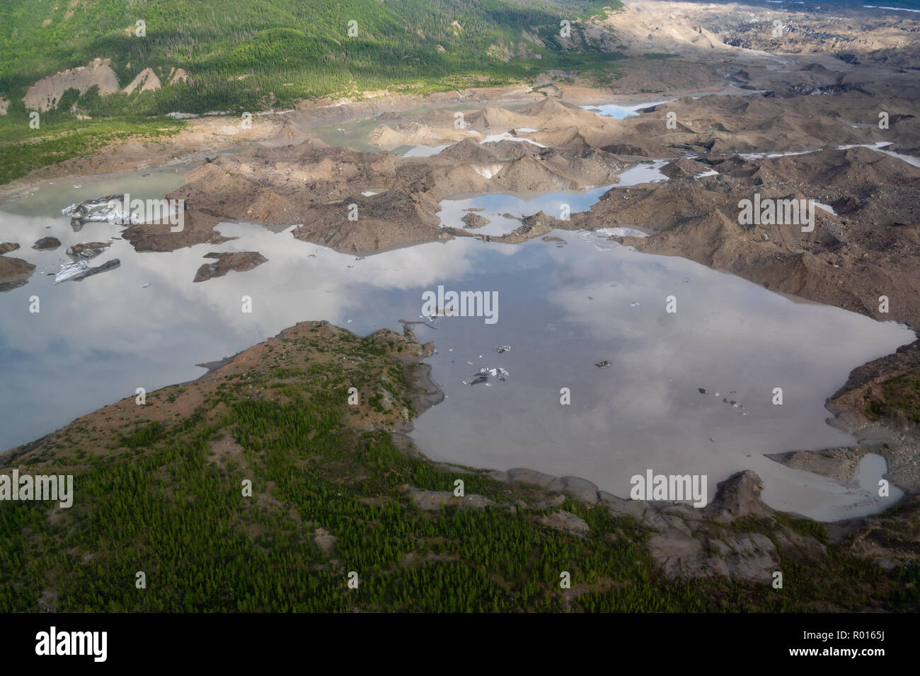 Close up aerial view of moraine, silt of Root Glacier in Wrangell St ...