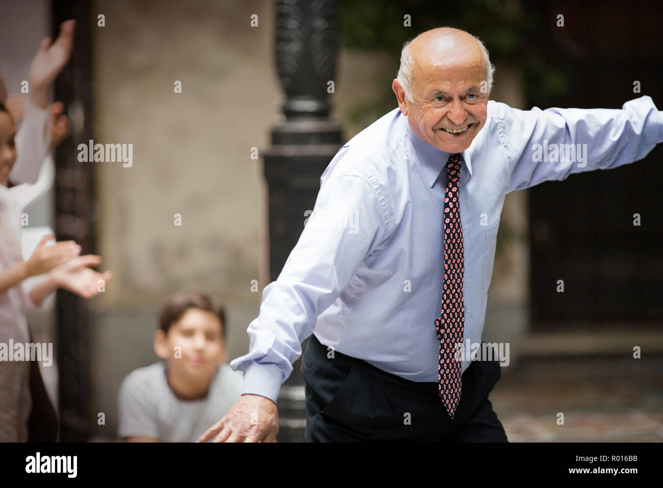 View of an elderly man dancing to a musical step Stock Photo - Alamy