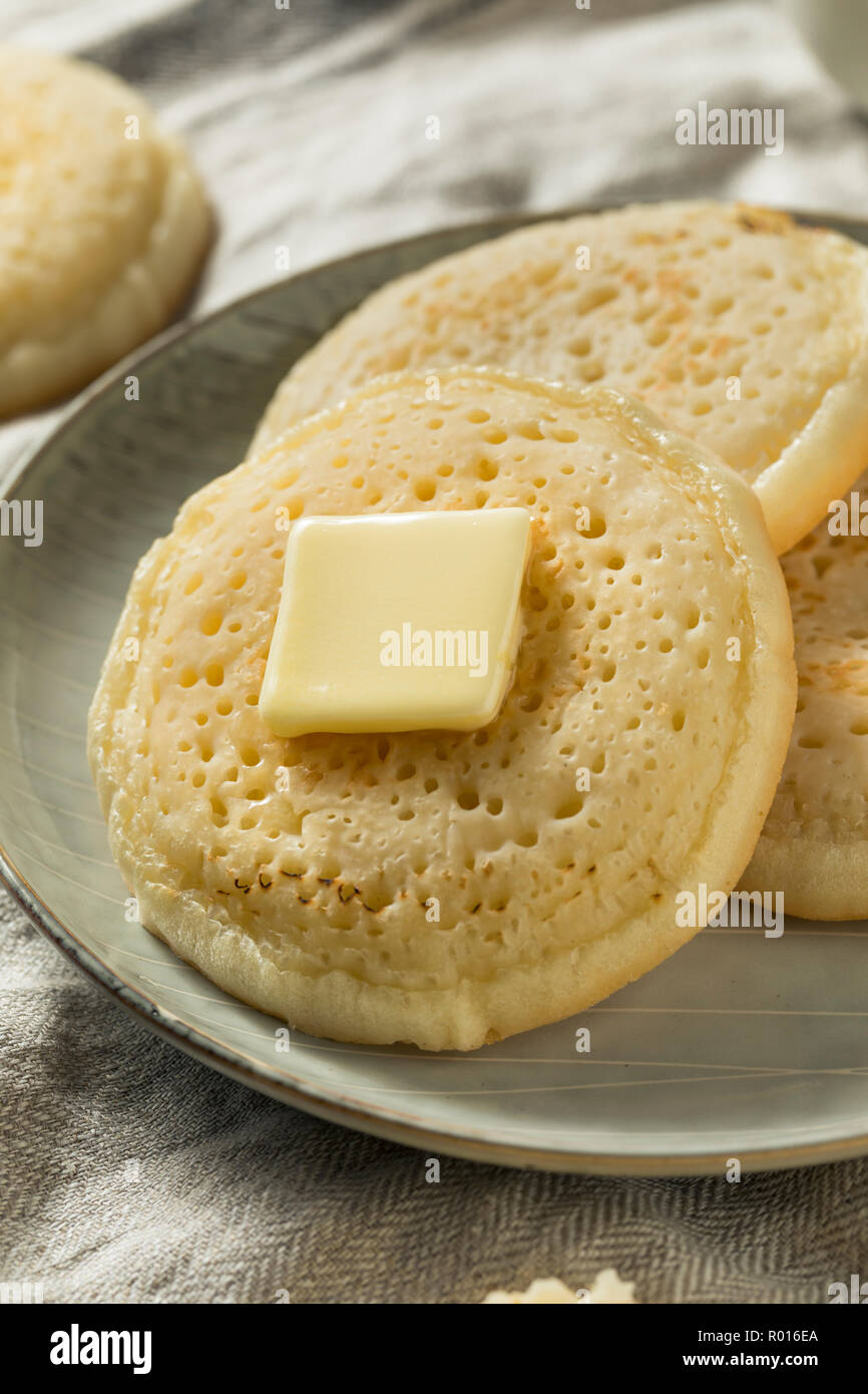 Homemade Grilled British Crumpets with Butter for Breakfast Stock Photo ...
