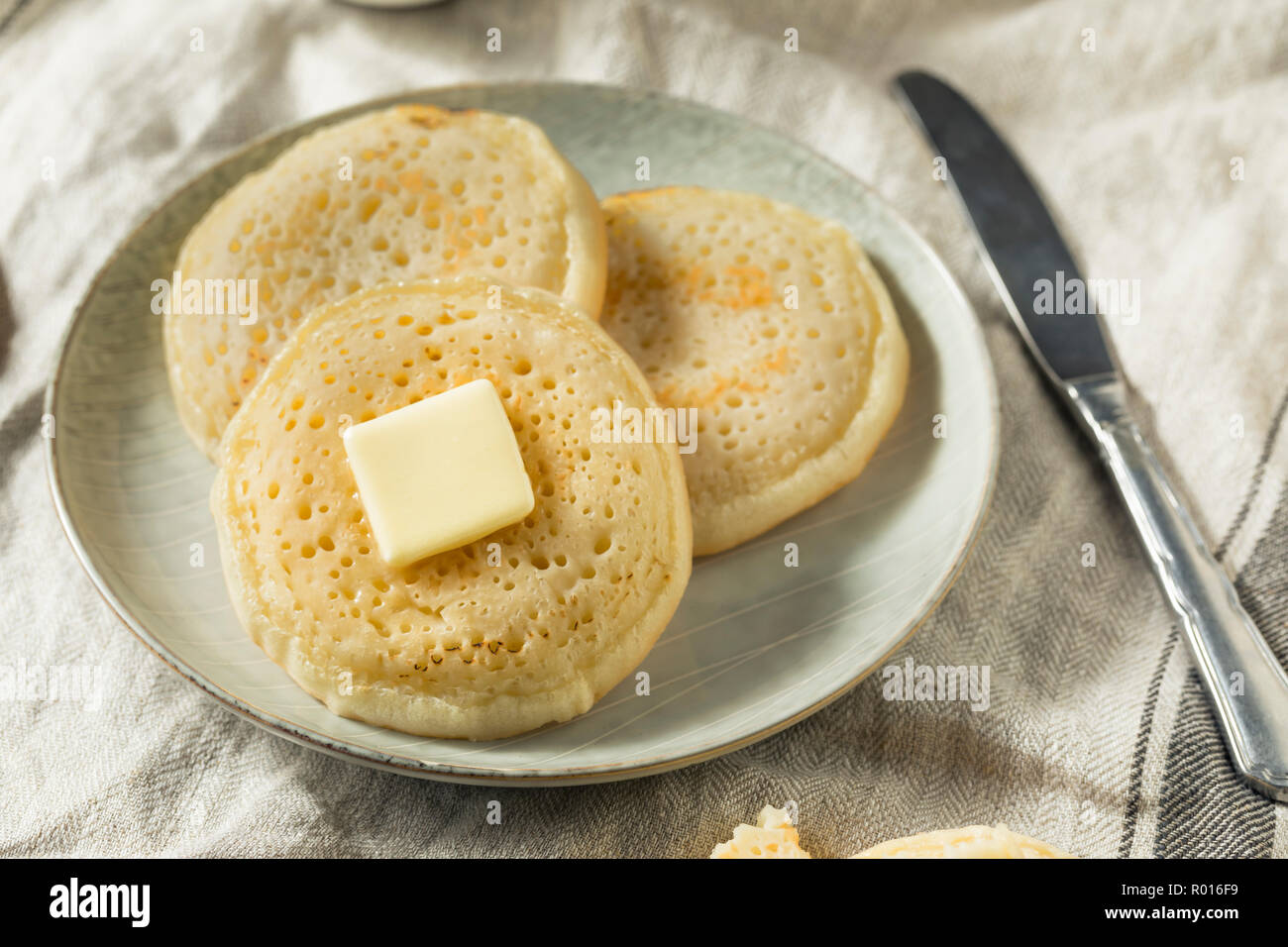Homemade Grilled British Crumpets with Butter for Breakfast Stock Photo ...