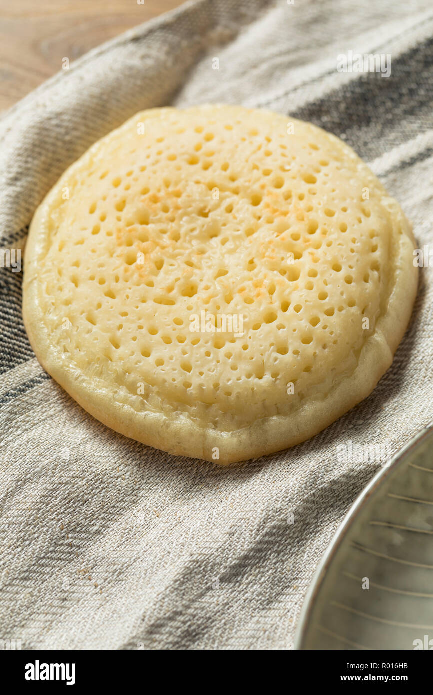 Homemade Grilled British Crumpets with Butter for Breakfast Stock Photo ...