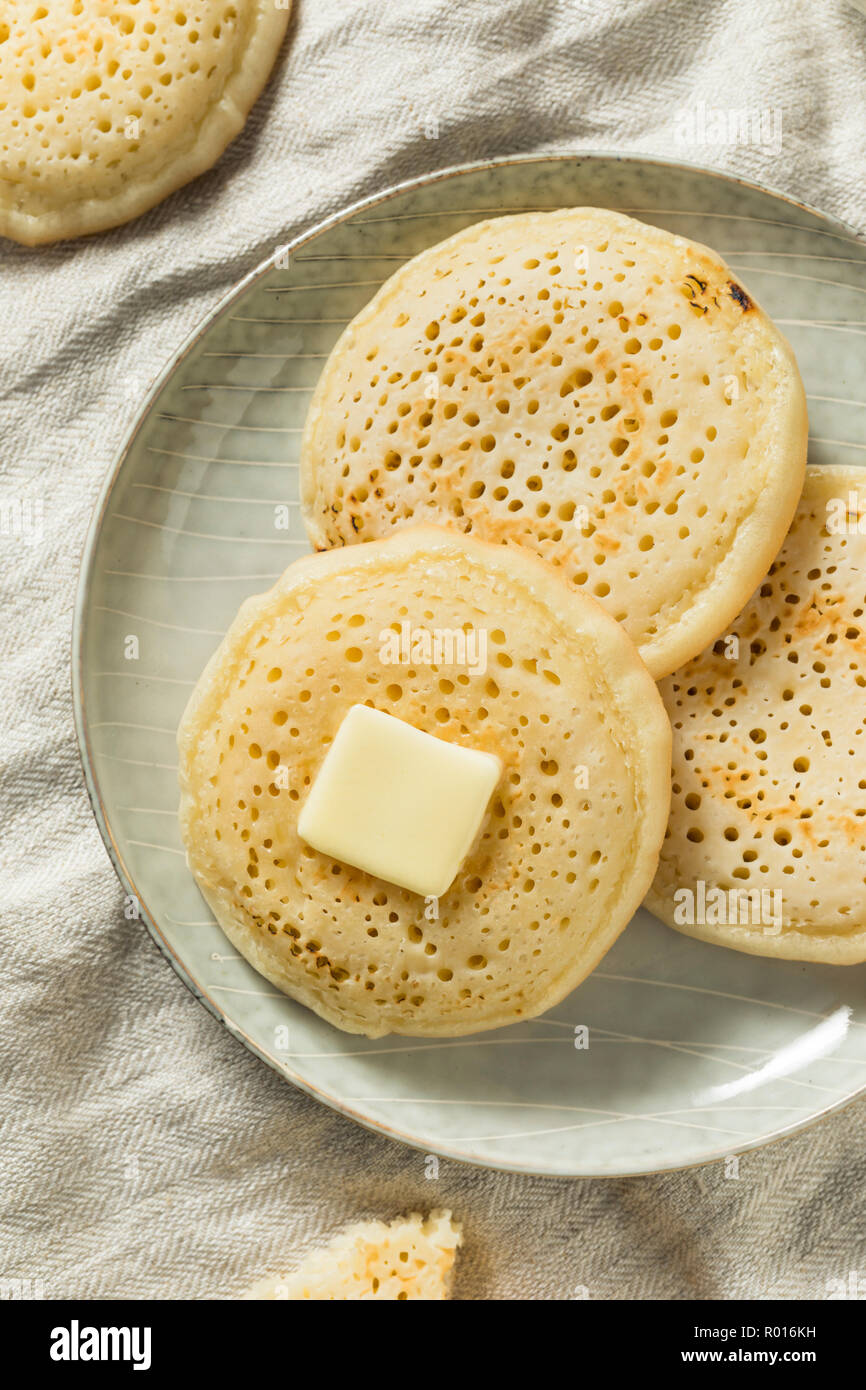 Homemade Grilled British Crumpets with Butter for Breakfast Stock Photo ...
