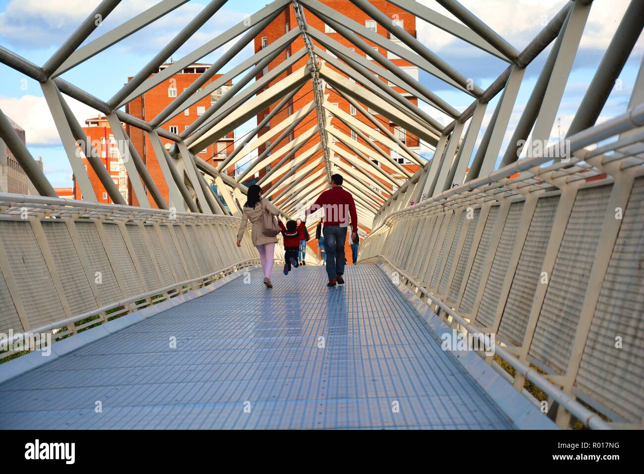family crossing a bridge, running and playing Stock Photo - Alamy