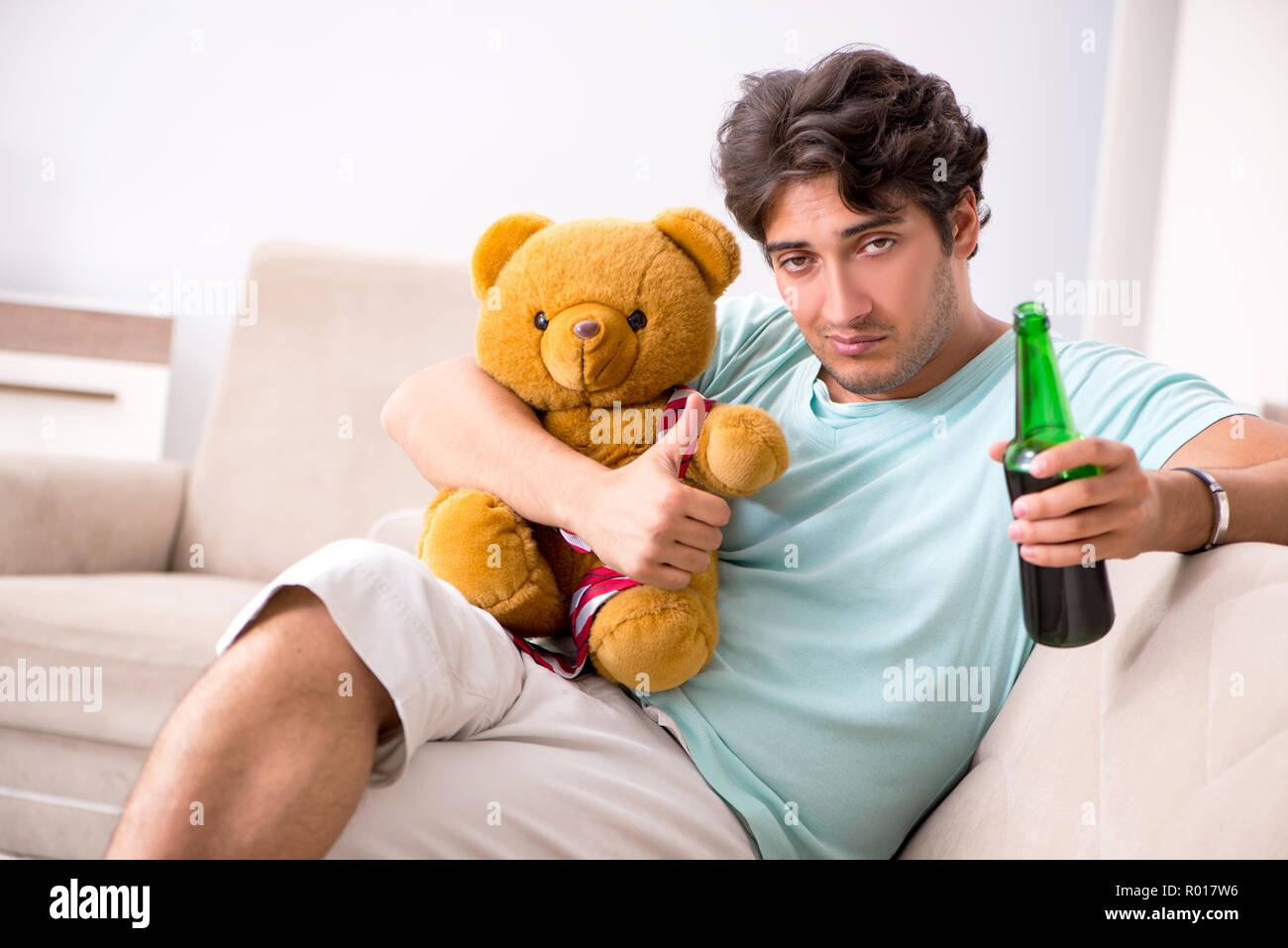 Young drunk handsome man after party at home Stock Photo - Alamy