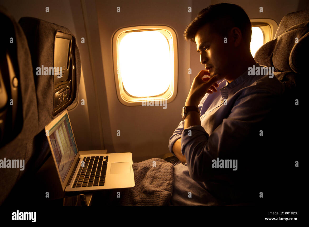 Young men by plane Stock Photo - Alamy