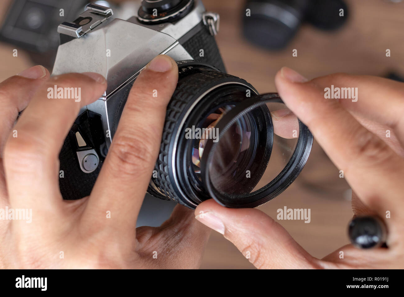 Placing a filter photographic camera Stock Photo - Alamy
