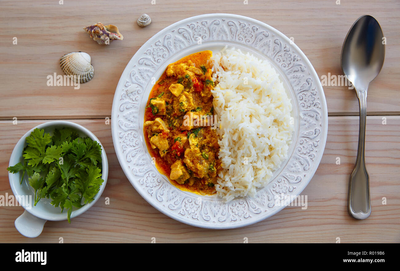 Chicken curry dish indian recipe on dark wood table Stock Photo - Alamy