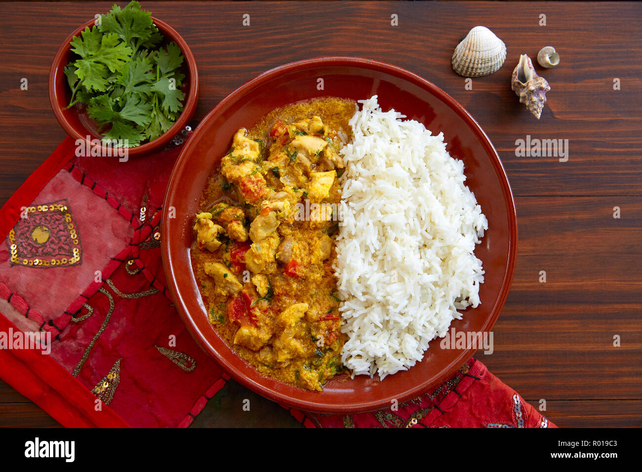 Chicken curry dish indian recipe on dark wood table Stock Photo - Alamy