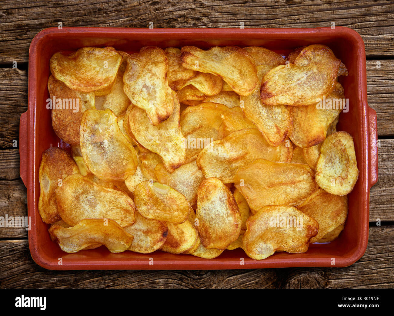 Homemade fried potatoes sliced chips in a clay pot Stock Photo - Alamy