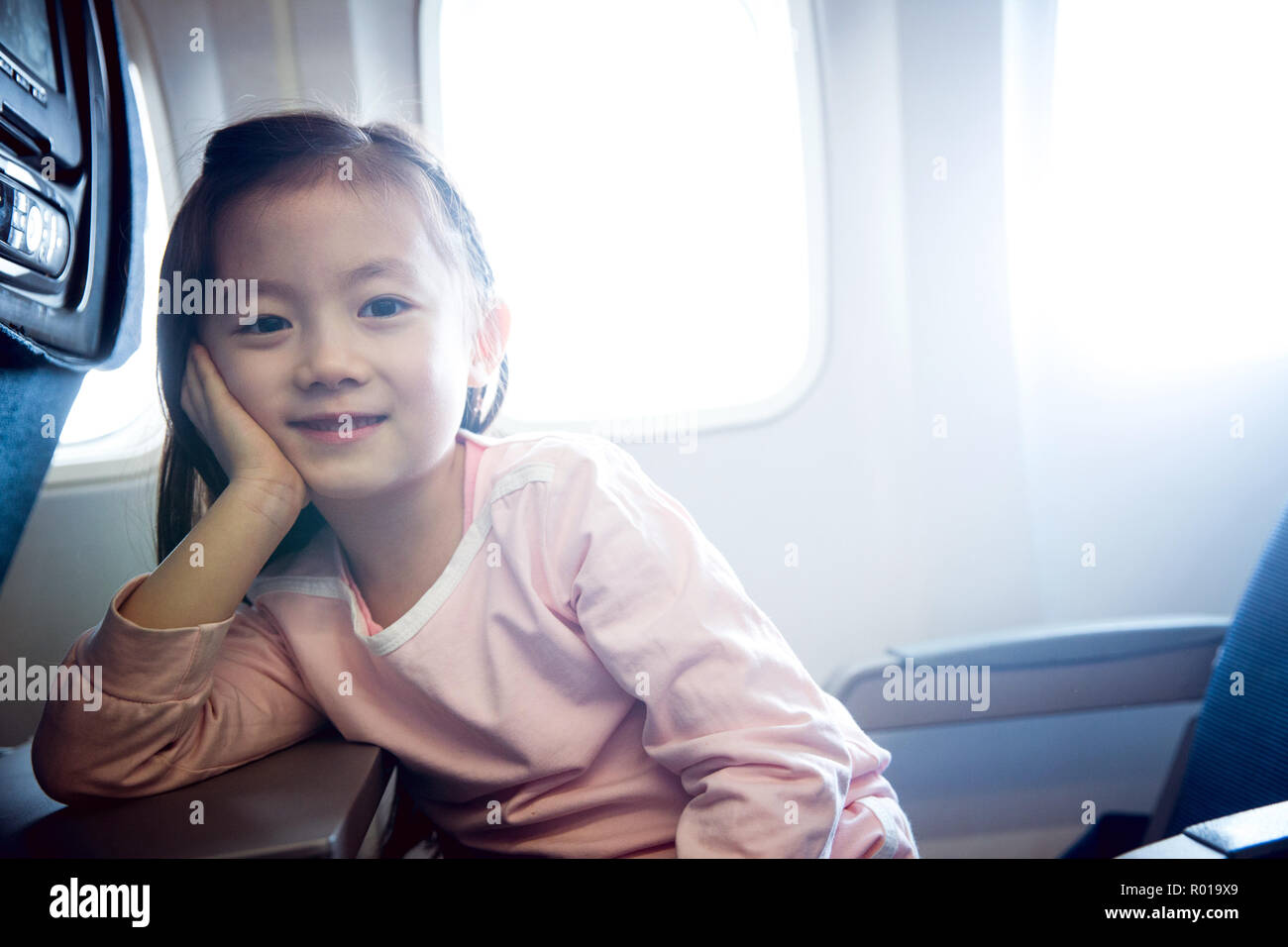 Cute girl on the plane Stock Photo - Alamy