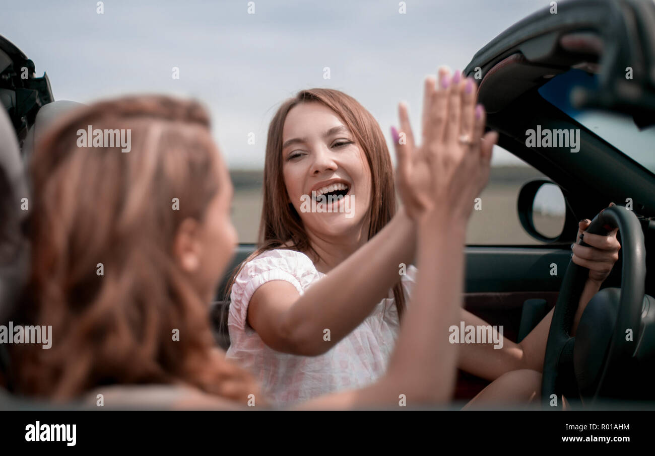 close up.attractive girlfriends giving each other high five Stock Photo ...