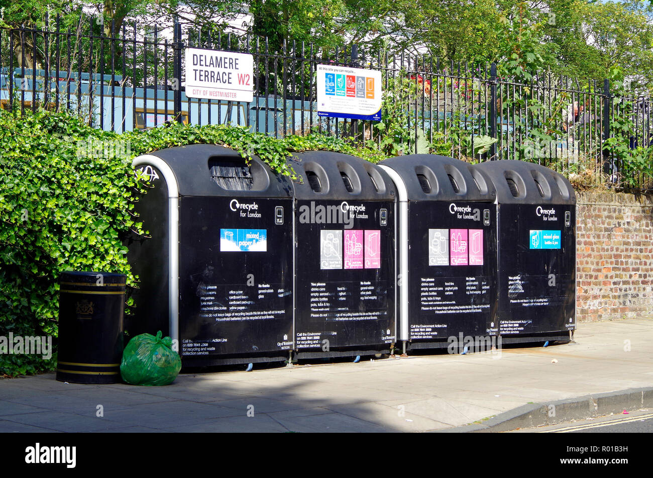 Large black recycling bins against the retaining wall of the Grand ...