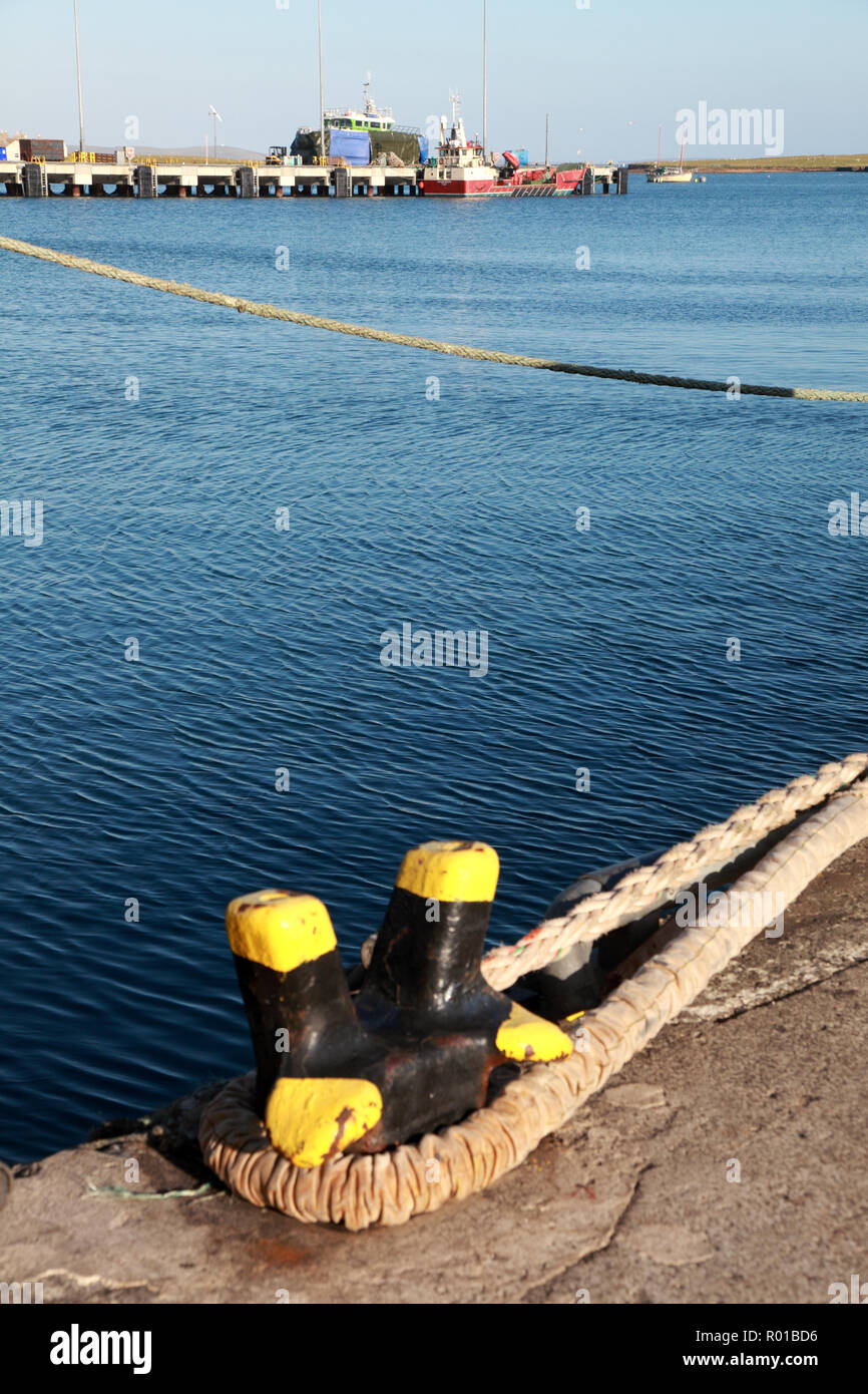 Ropes round a capstan in the harbour in Stromness, Orkney, Scotland ...