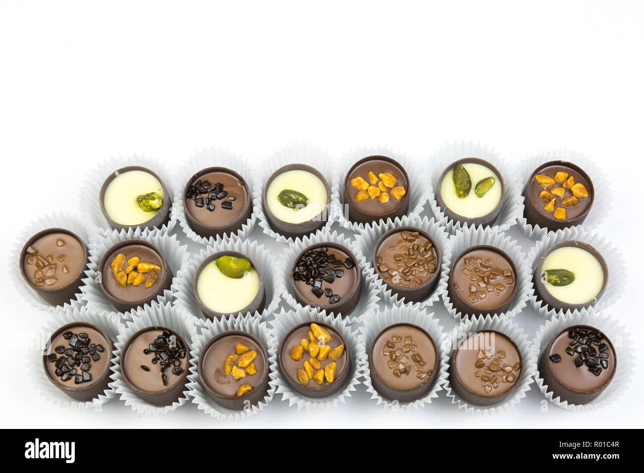 Chocolate candies in paper Cut Out Stock Images & Pictures - Alamy