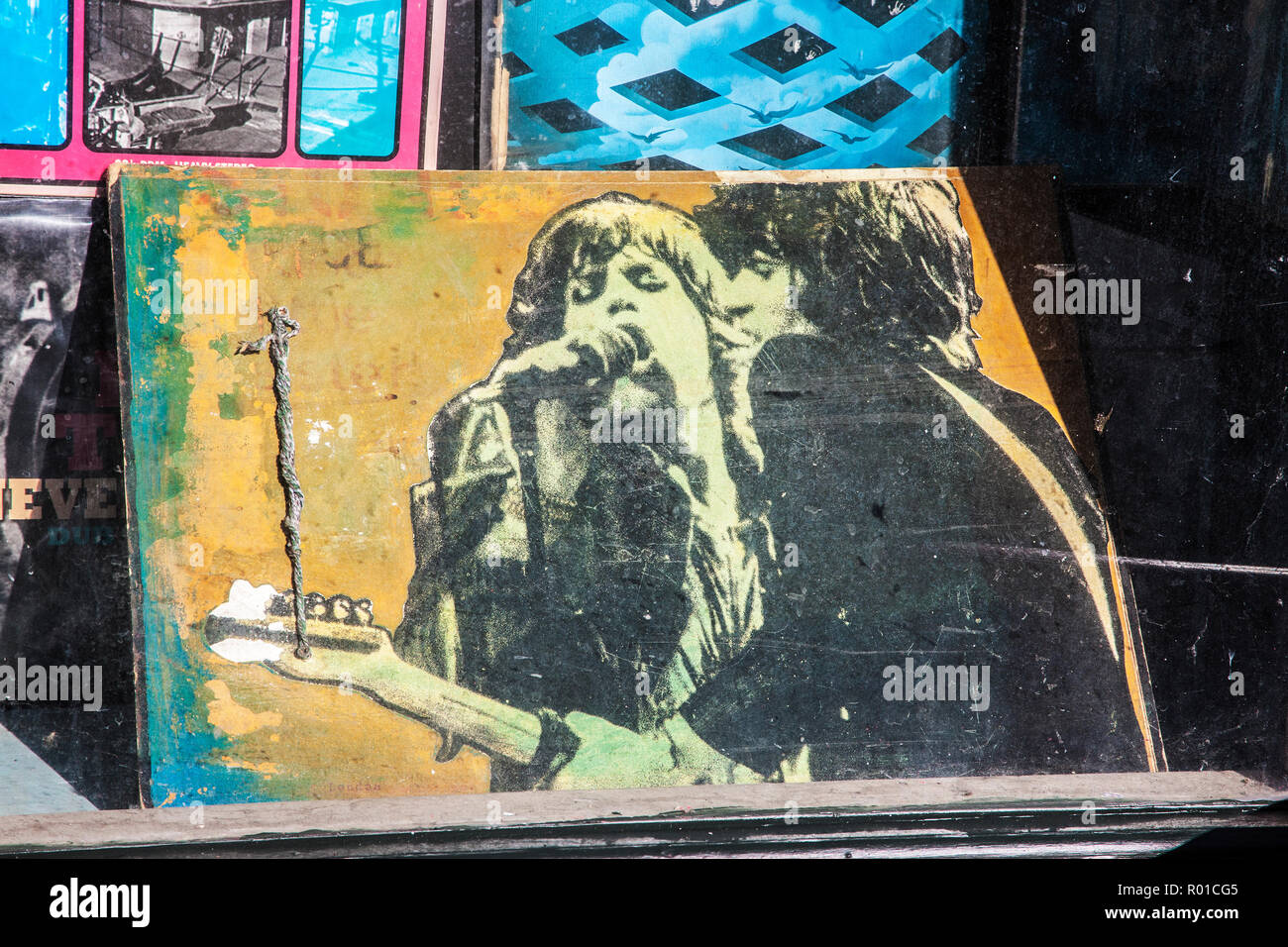 painting of Keith Richards and mick Jagger, in window of second hand ...