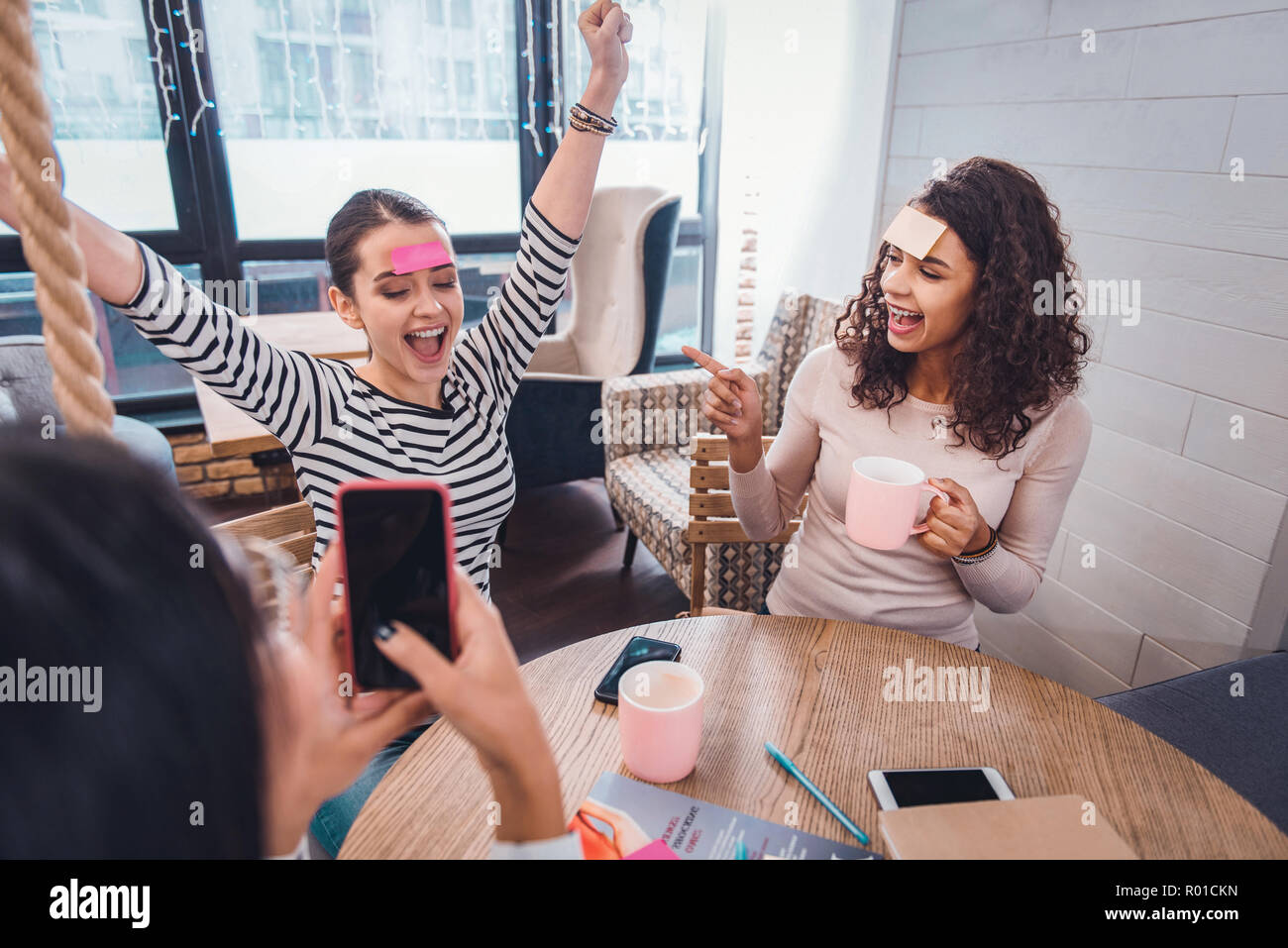 Happy positive nice women having fun together Stock Photo - Alamy