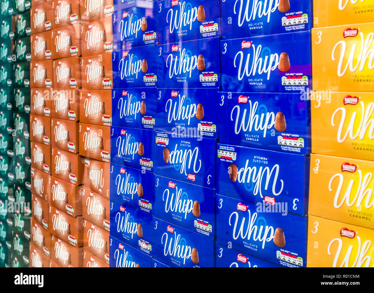 Colourful red blue yellow green stacked multiple boxes of chocolate hi ...