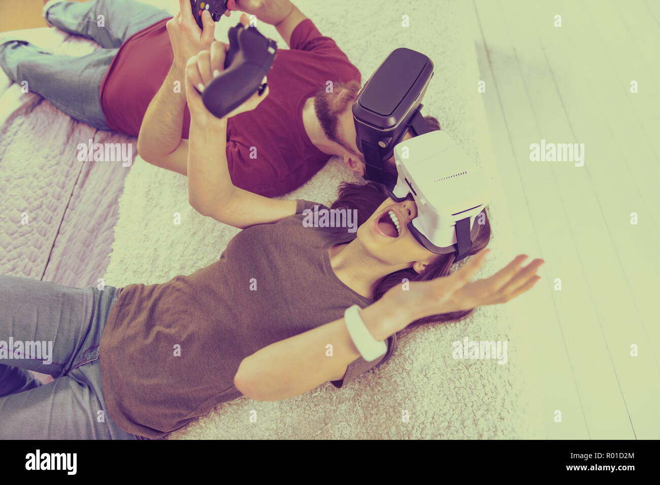 Young people having fun playing video games Stock Photo - Alamy