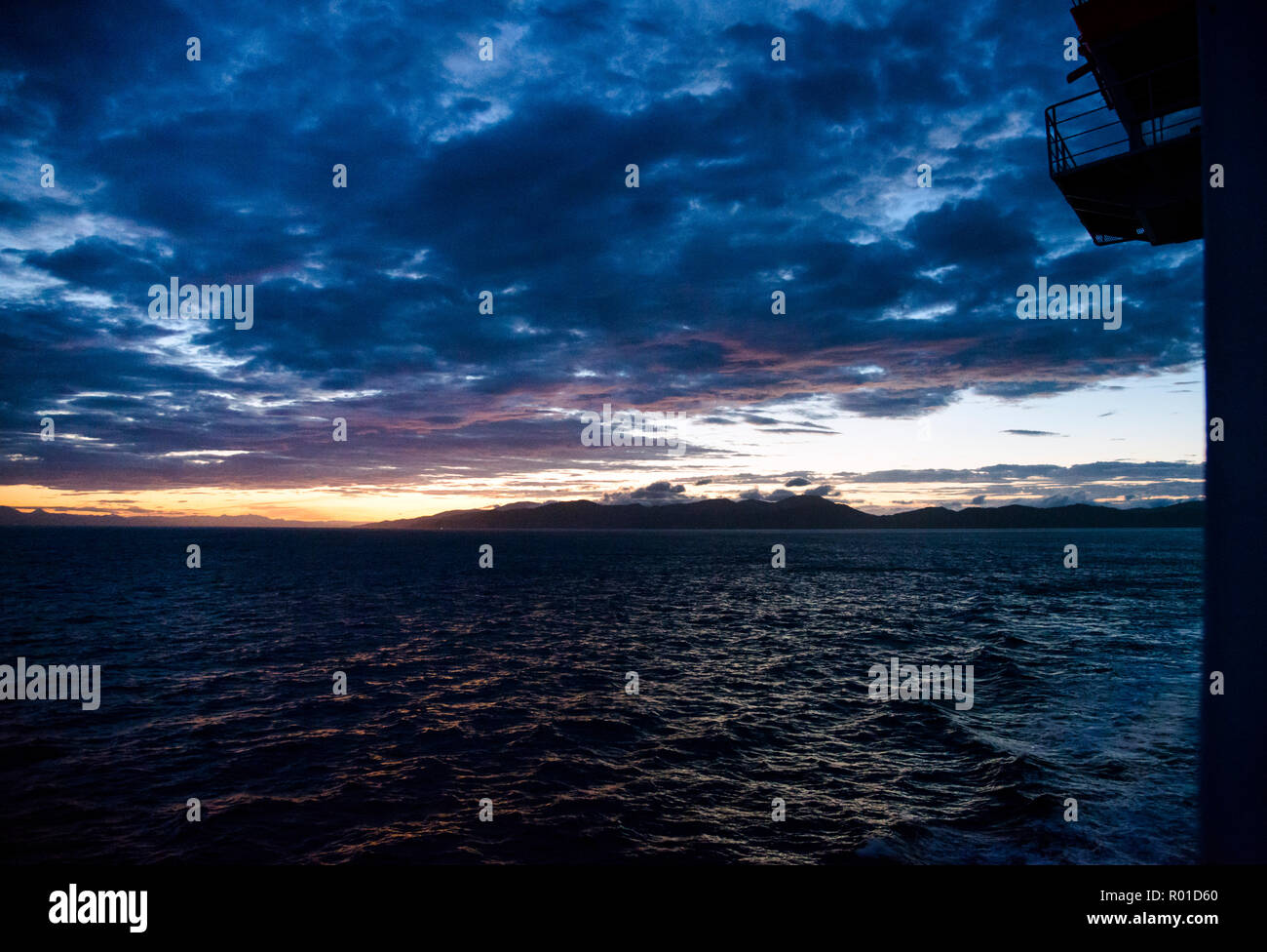 A dramatic sunset sky over the landscape of the South Island of New ...