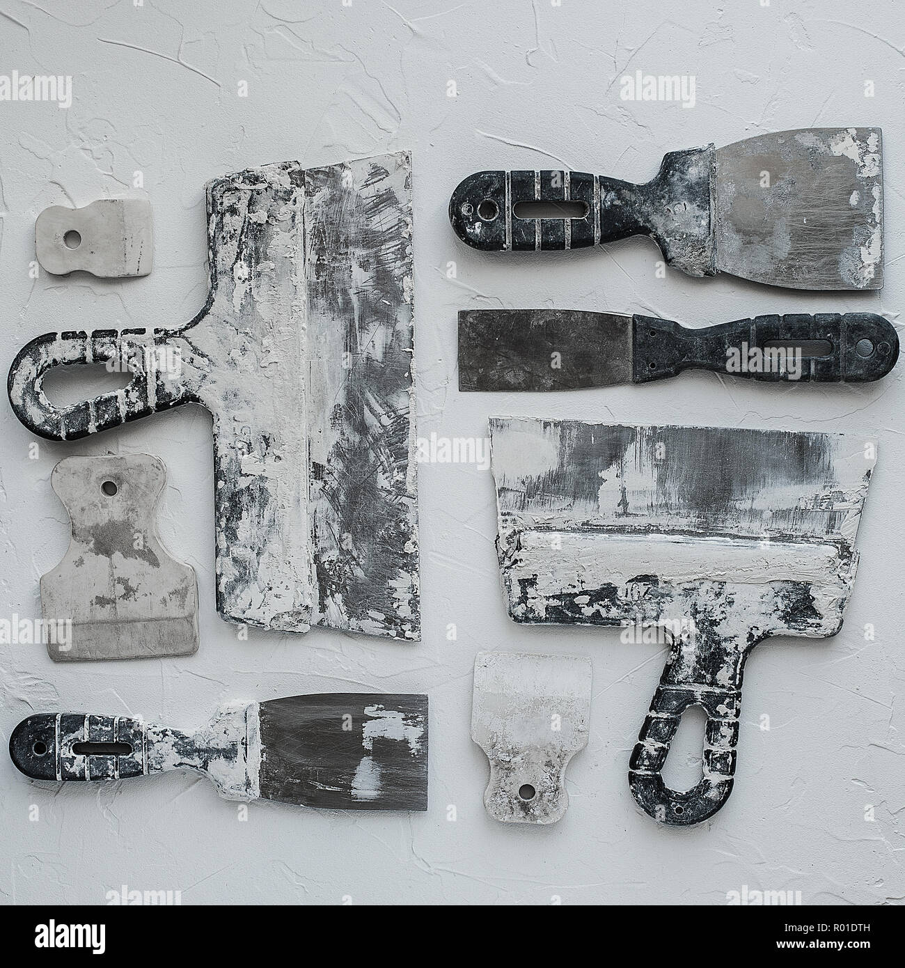 Kit of putty knives. Spatulas with the remaining mortar. Gastarbeiter ...