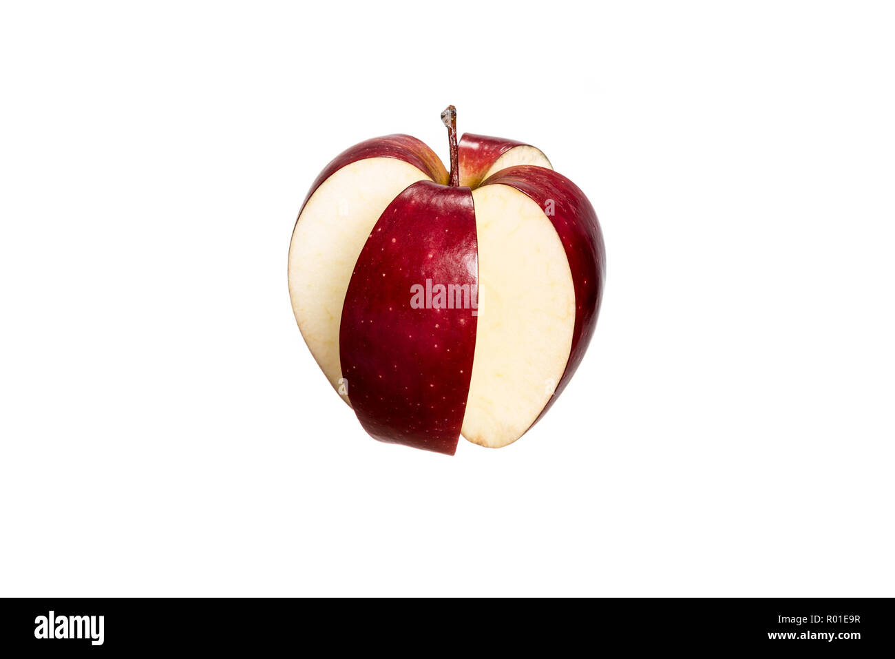 Red cut four part apple isolated on a white background. Conceptual ...