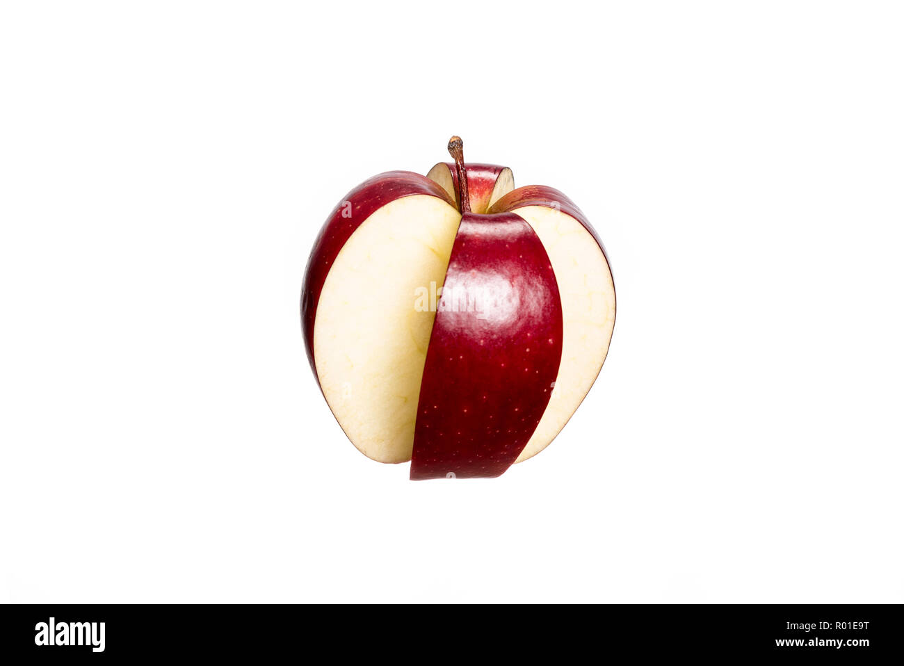 Red cut four part apple isolated on a white background. Conceptual ...