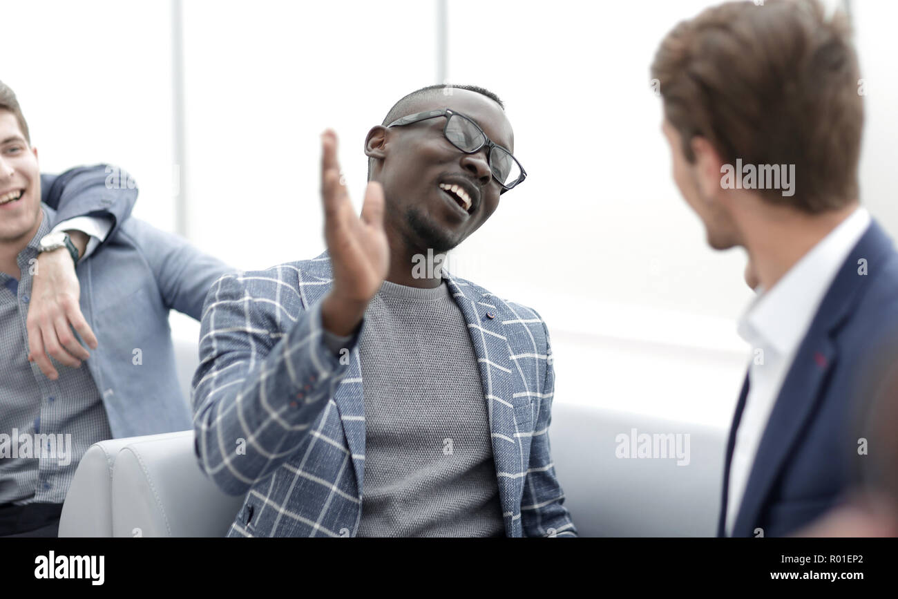 close up.cheerful co-workers giving each other a high five Stock Photo ...
