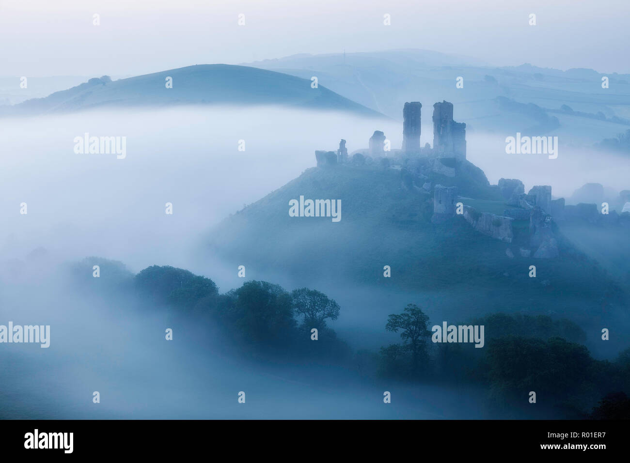 Corfe Castle in the mist, Dorset, England Stock Photo - Alamy
