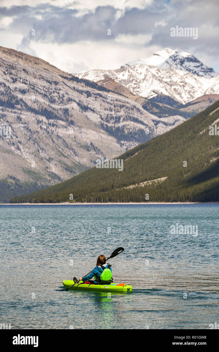 BANFF, AB, CANADA - JUNE 2018: Scenic view of a visitor paddling a ...