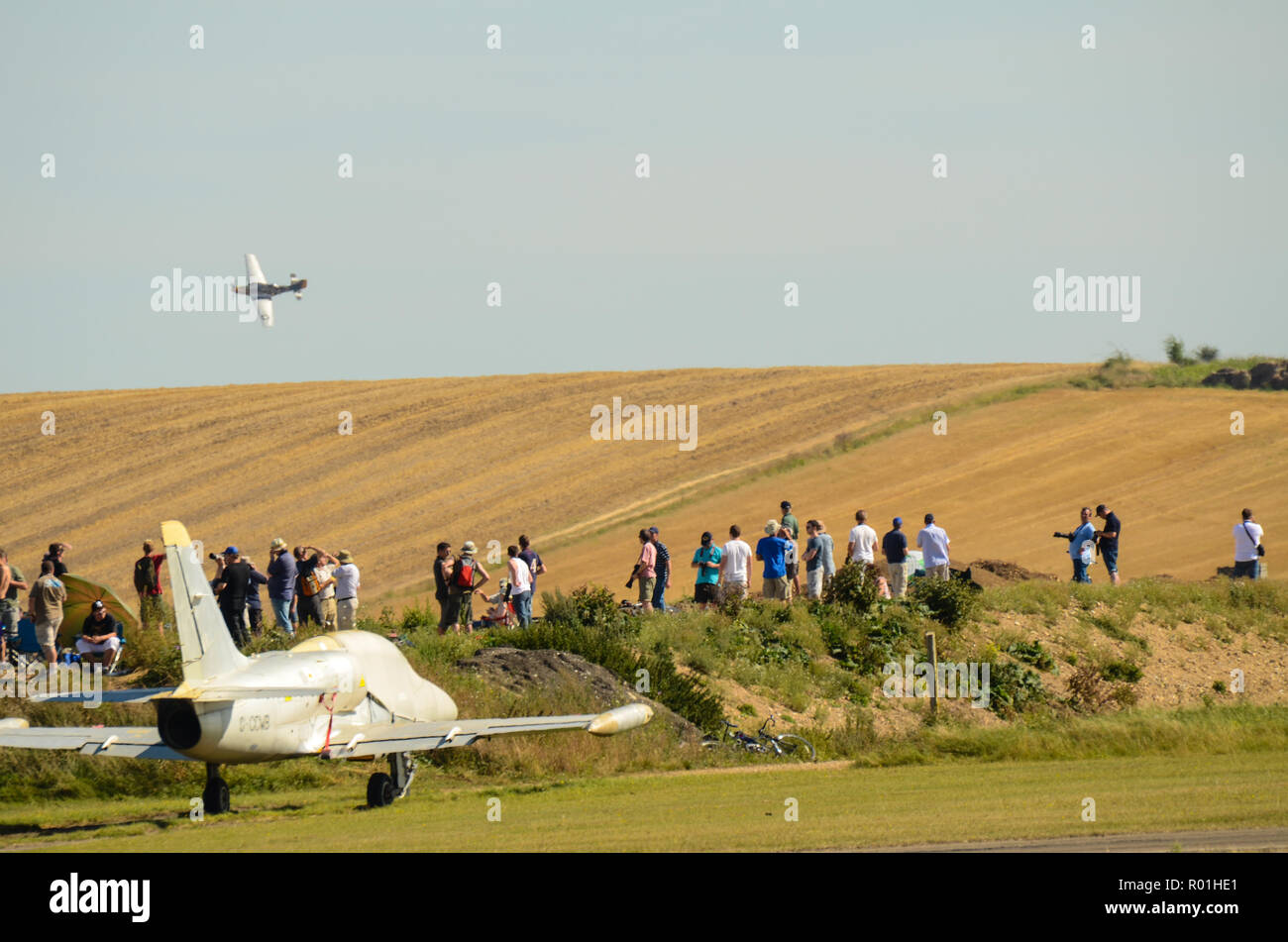 Secondary crowd at an airshow. People watching air display from outside ...