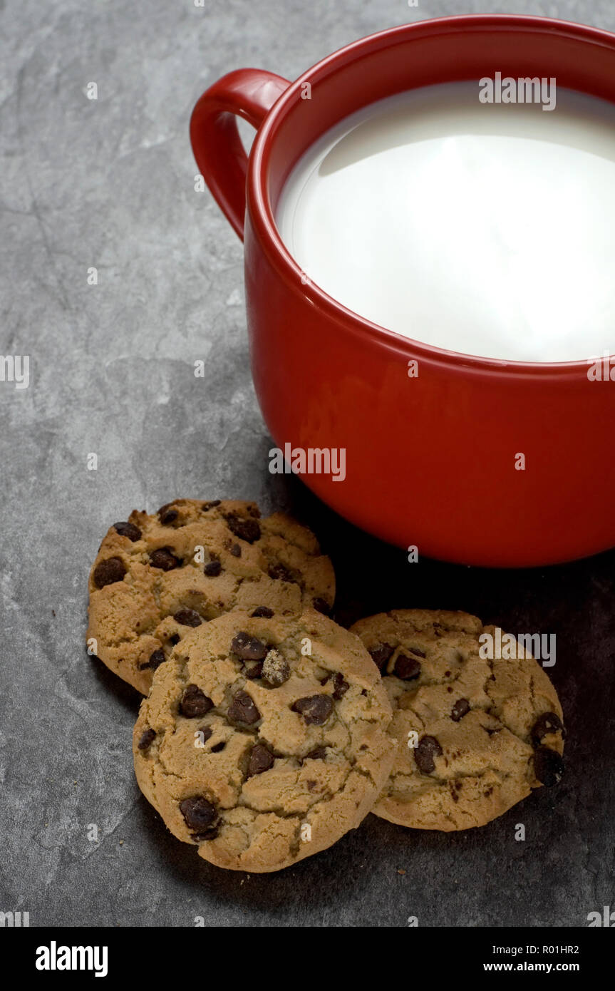 Delicious chocolate Chip Cookies with Red Milk Cup on Kitchen Counter ...