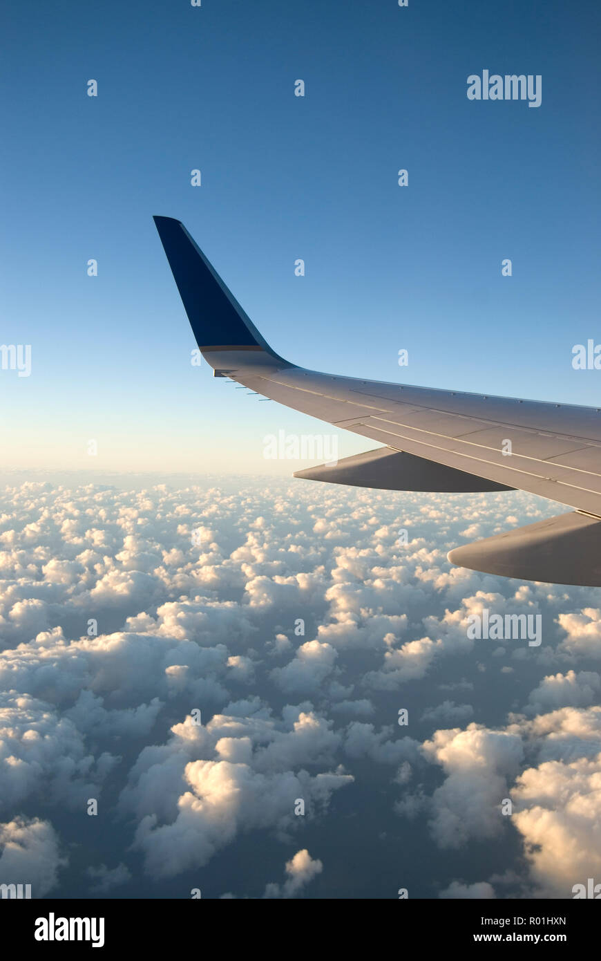 Airplane Wing with Beautiful Clouds Viewed from the Cabin Stock Photo ...