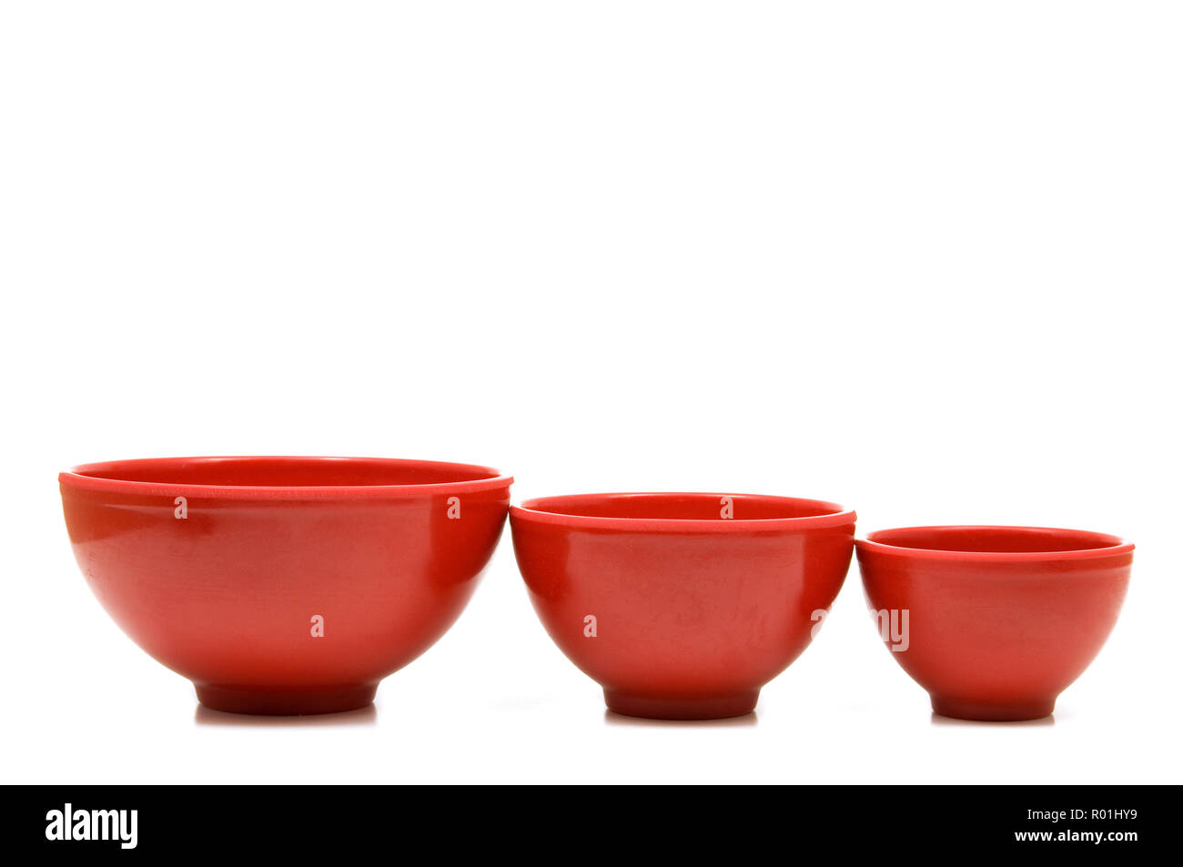 Isolated Red Bowls on White Line Up Perfectly Stock Photo - Alamy