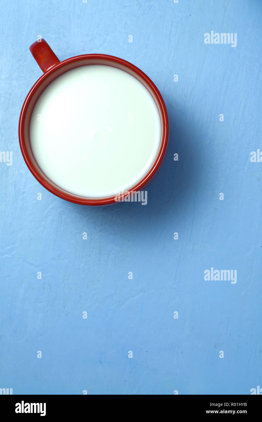 Beautiful Large Red Cup with Milk on a Light Blue Background Stock ...