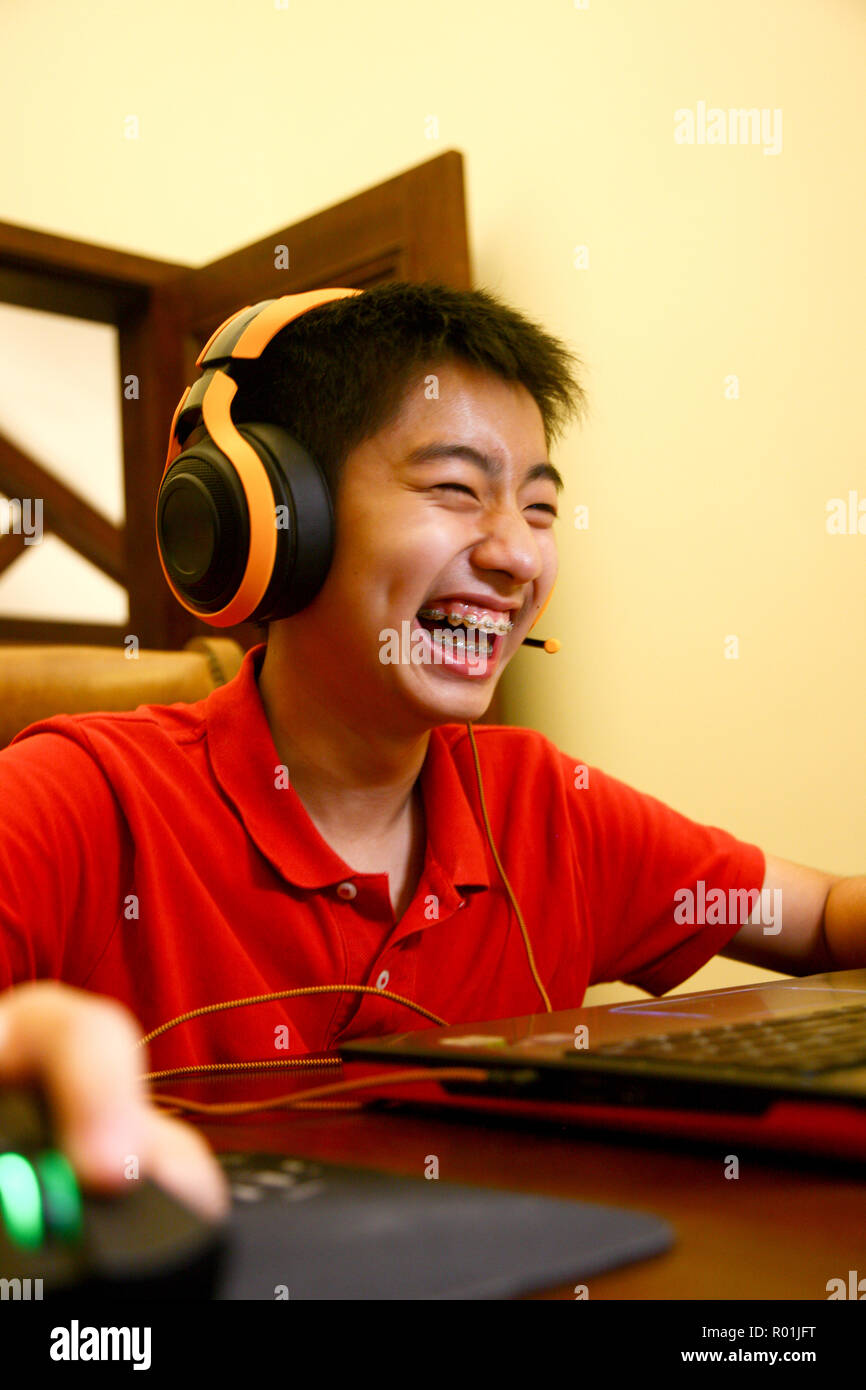 The boy use the computer Stock Photo - Alamy