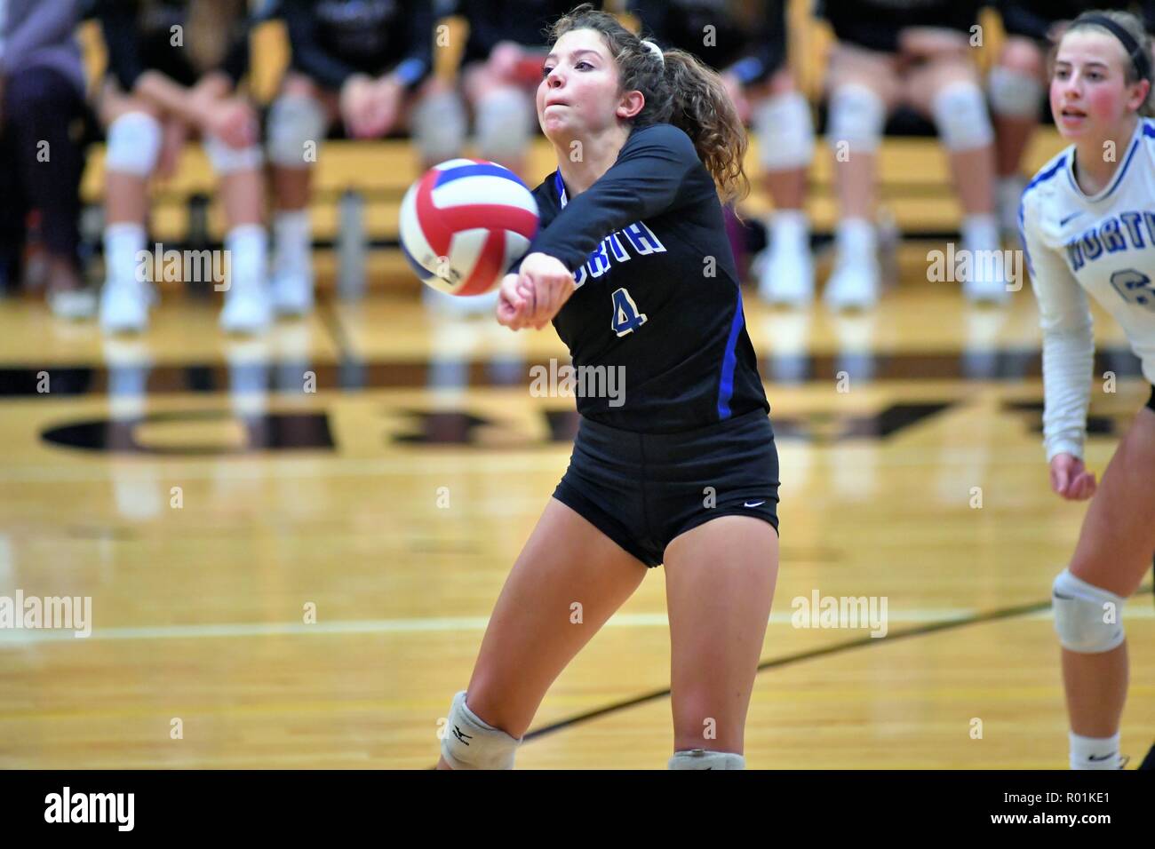 Player successfully dealing with an opponent's shot to keep a volley ...