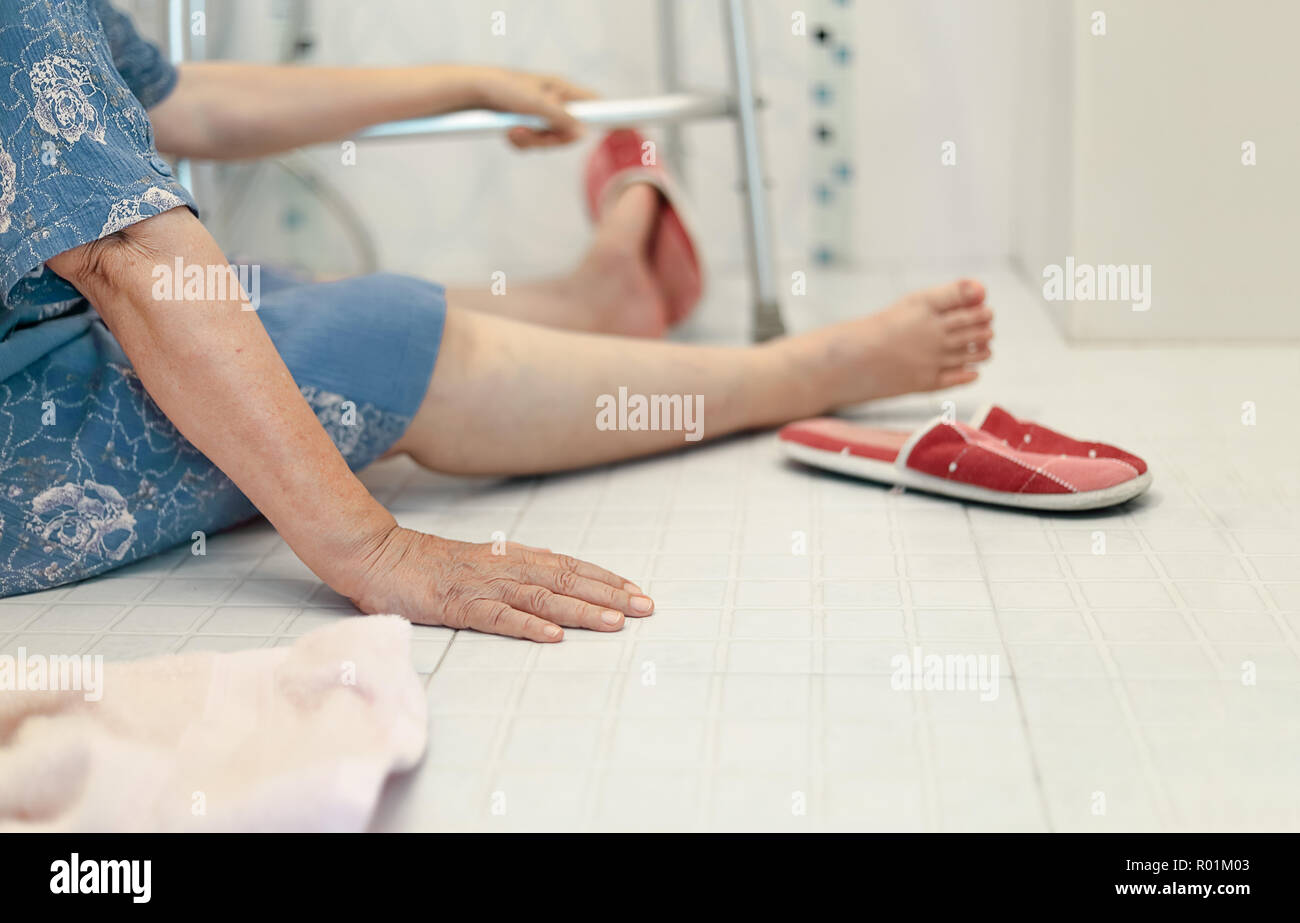 Elderly woman falling in toilet Stock Photo - Alamy
