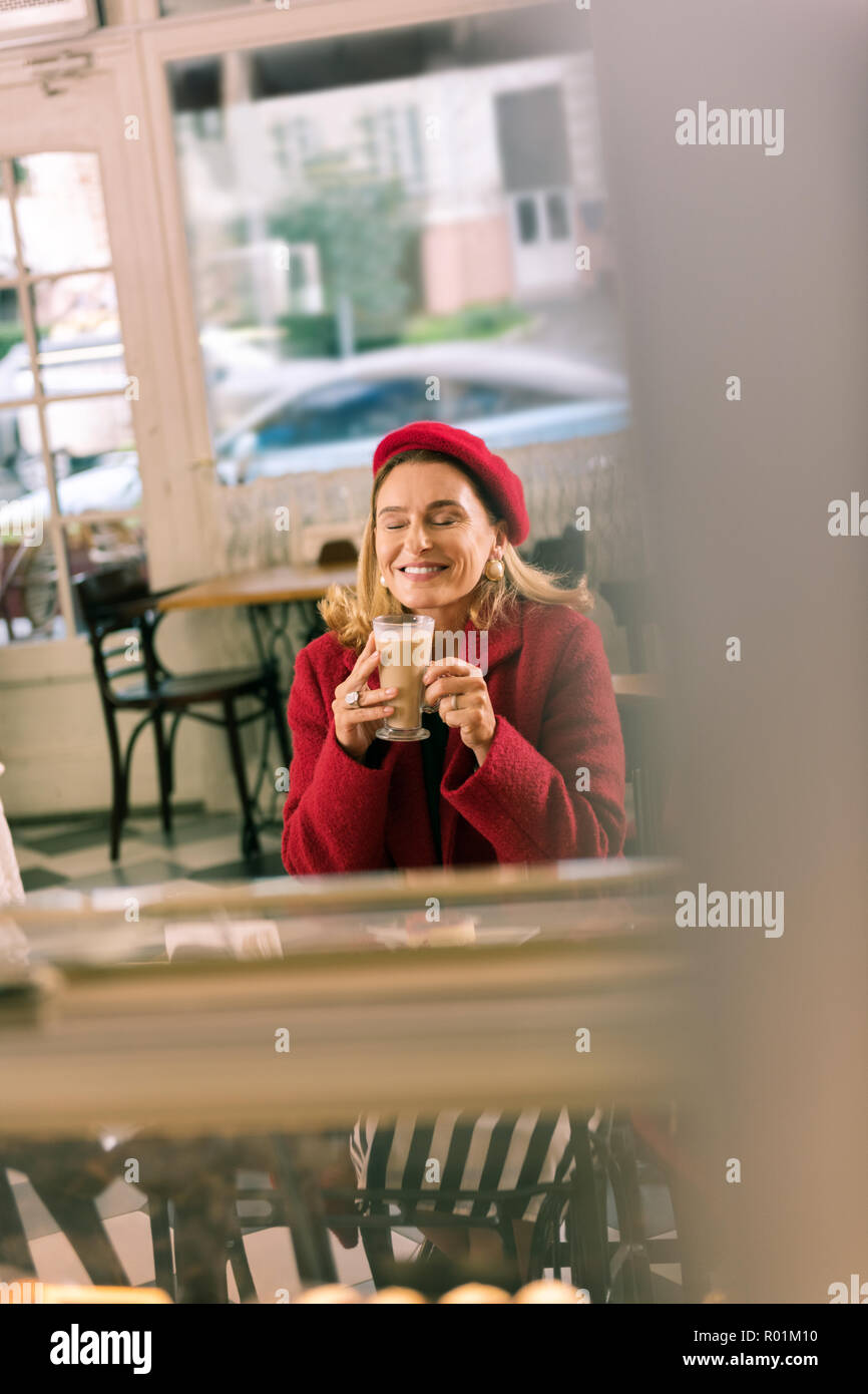Beautiful lady feeling relaxed drinking some coffee during break Stock ...