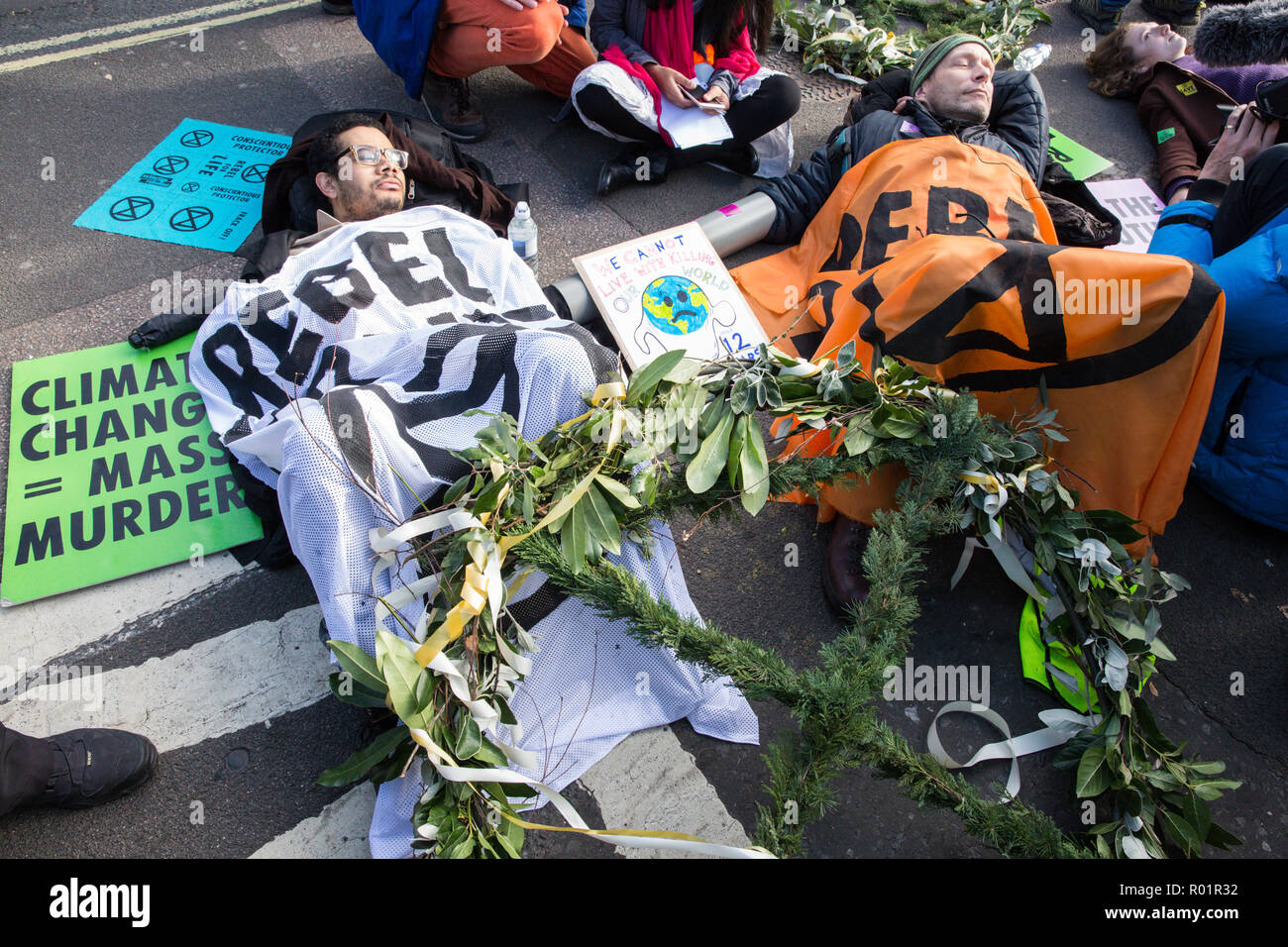 London, UK. 31st October, 2018. Environmental campaigners, some using ...