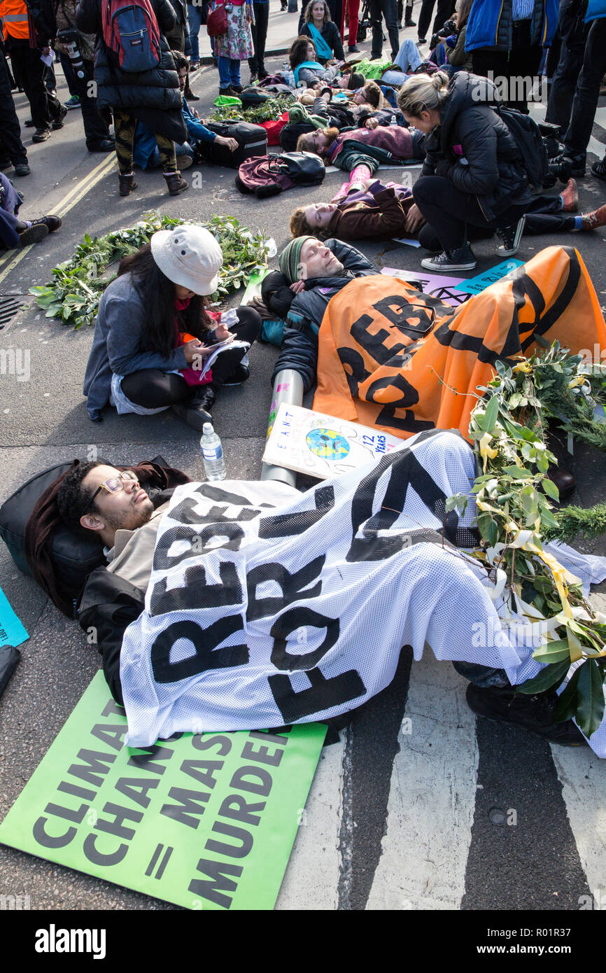 London, UK. 31st October, 2018. Environmental campaigners, some using ...
