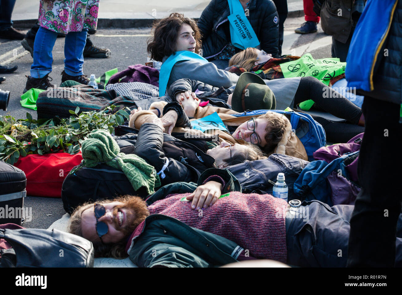 London, UK. 31st October, 2018. Environmental campaigners, some using ...