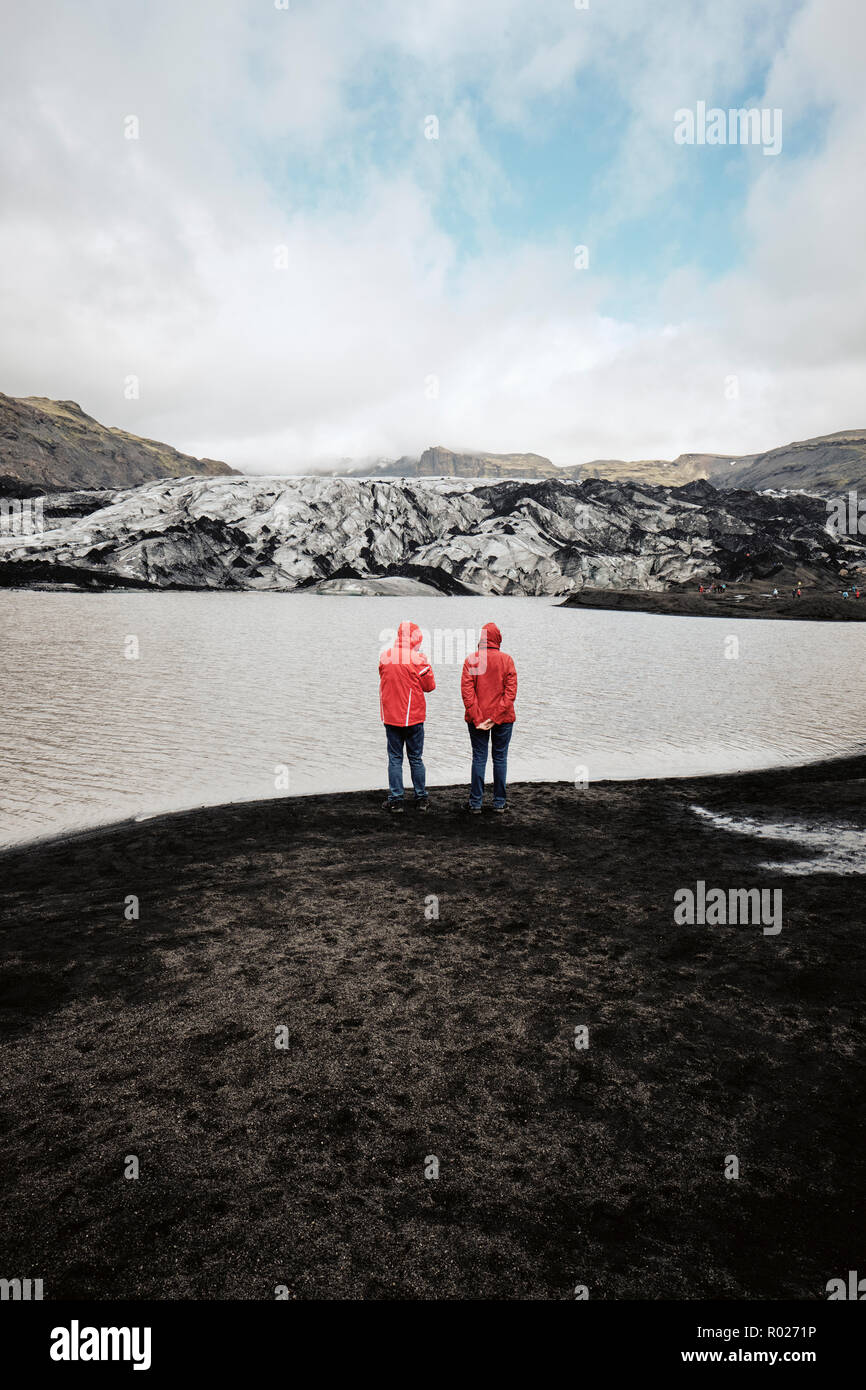 Tourists visiting the Sólheimajökull glacier part of the larger ...