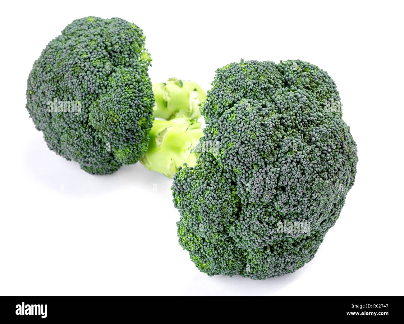 Fresh broccoli on wooden table Cut Out Stock Images & Pictures - Alamy