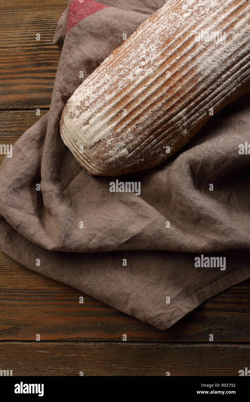 Rye bread on rustic background Stock Photo - Alamy